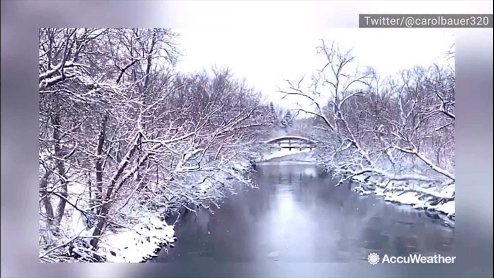 Snow falling around river makes for a beautiful view | krem.com