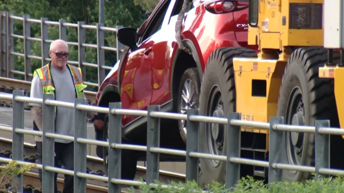 Car drives onto elevated light rail tracks in Seattle | krem.com