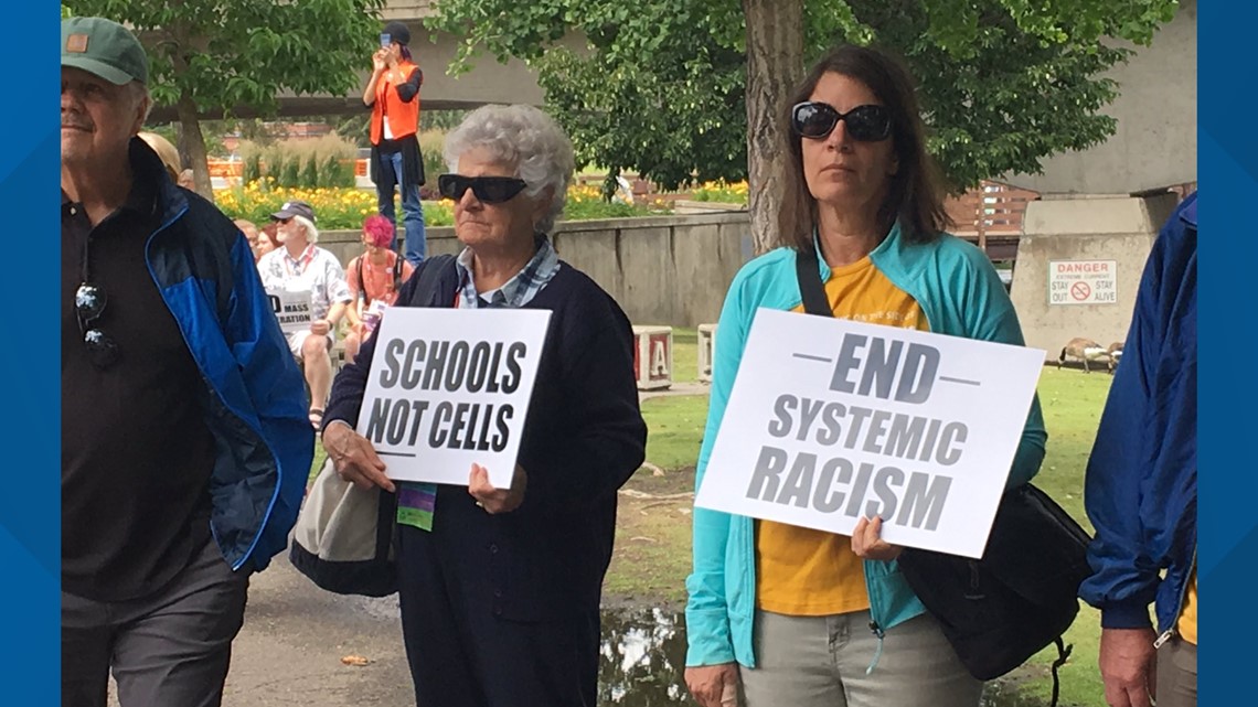 Hundreds of Unitarian Universalists protest new Spokane Co. Jail | krem.com