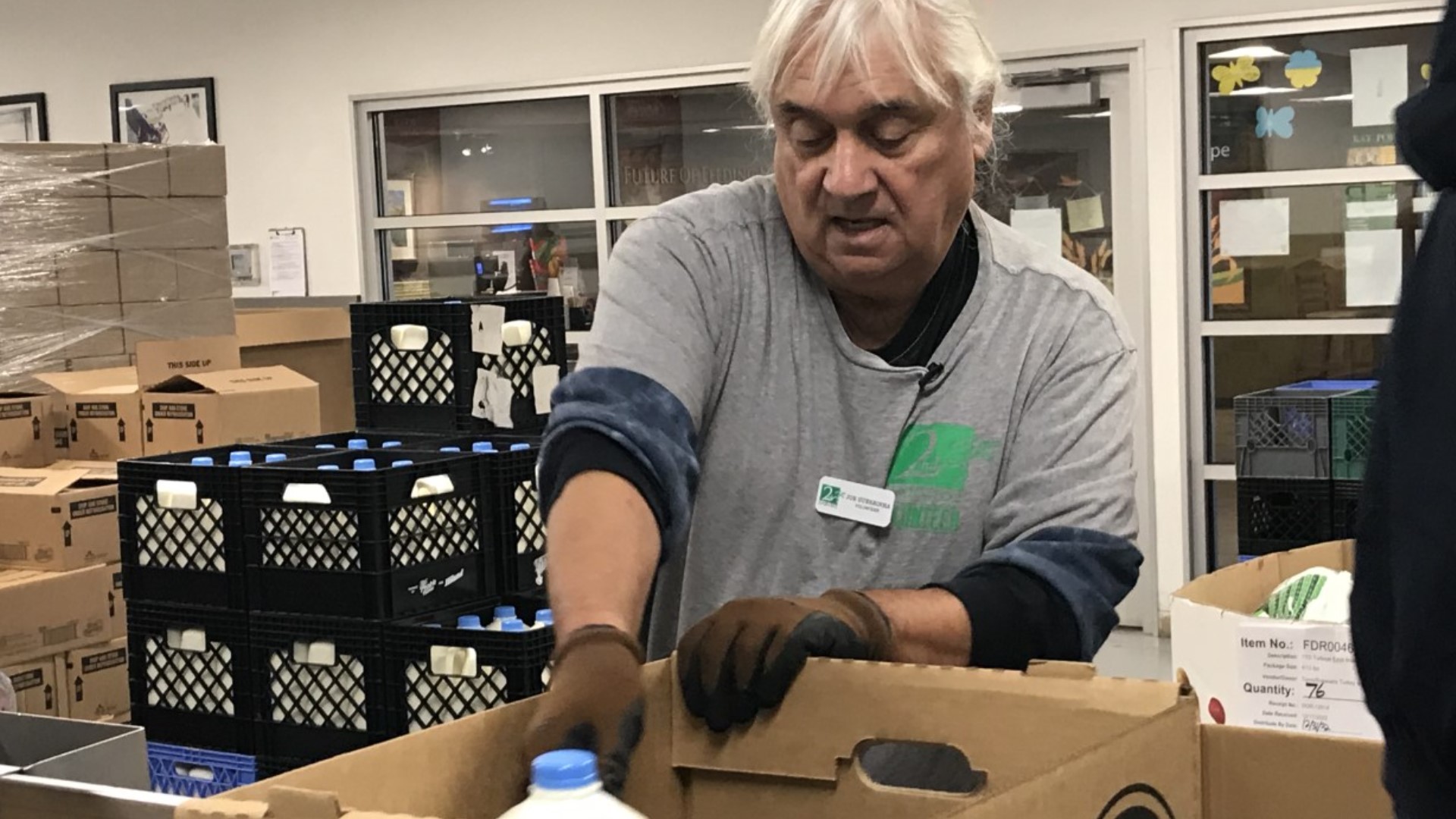 Volunteers pack Tom's Turkey Drive boxes | krem.com