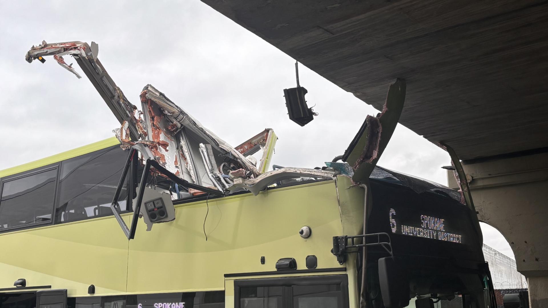 Spokane double-decker bus collides with railroad viaduct; four ...
