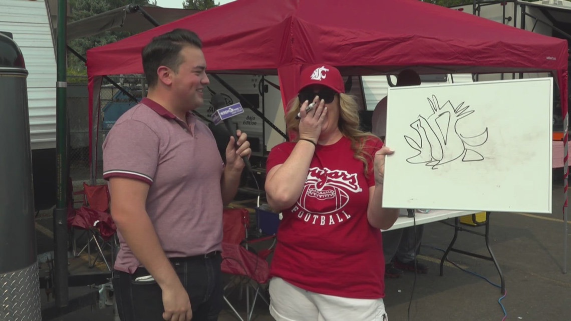 Tailgating fans draw pictures of the WSU logo, talk about the football ...