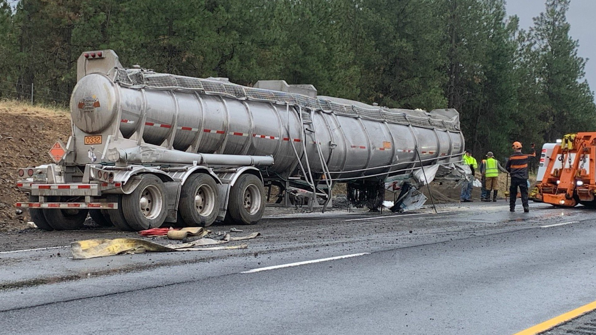 Eastbound I-90 remains closed after truck crashes, leaks hazardous ...