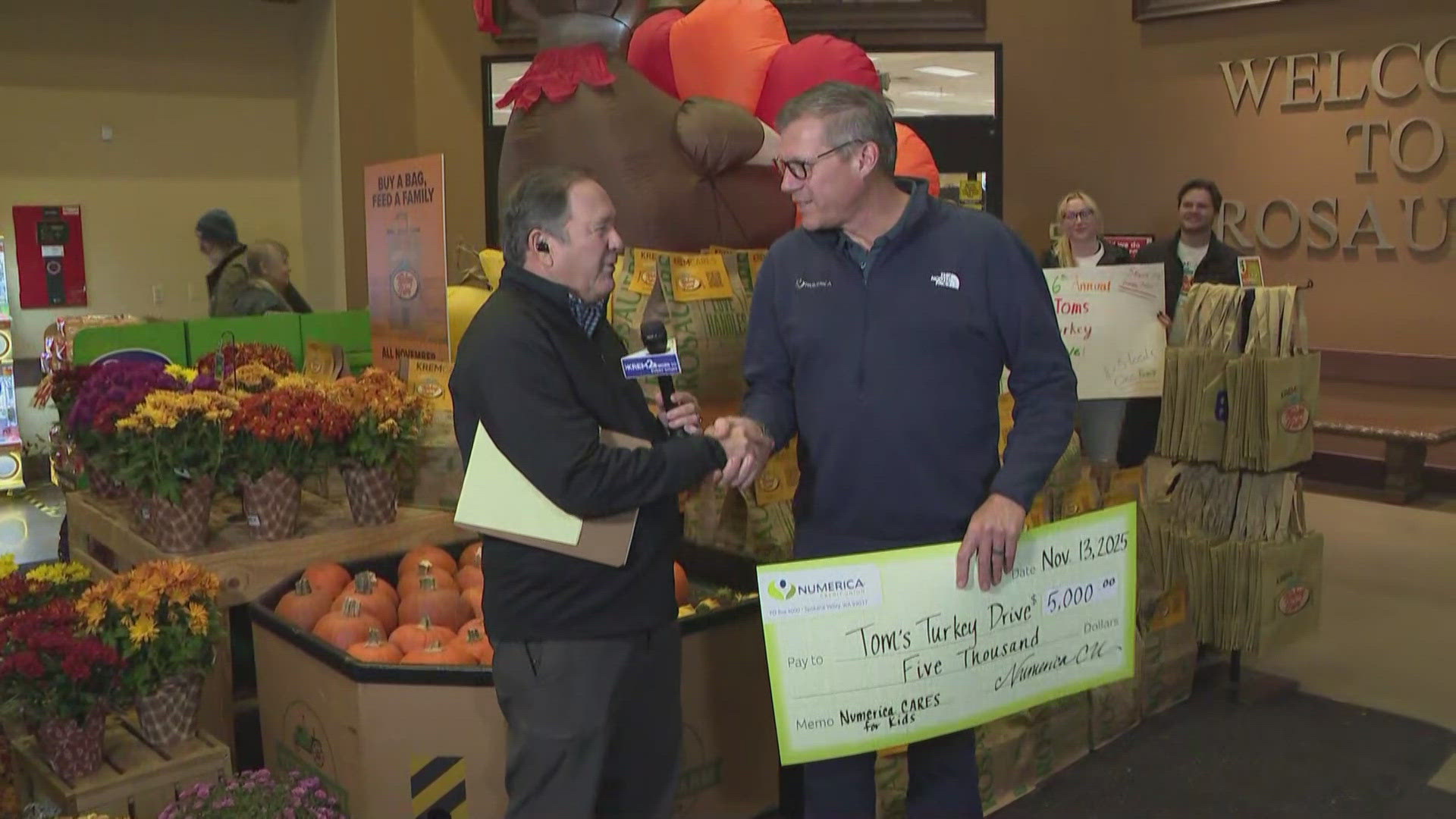 Numerica presents donation to Tom's Turkey Drive | krem.com