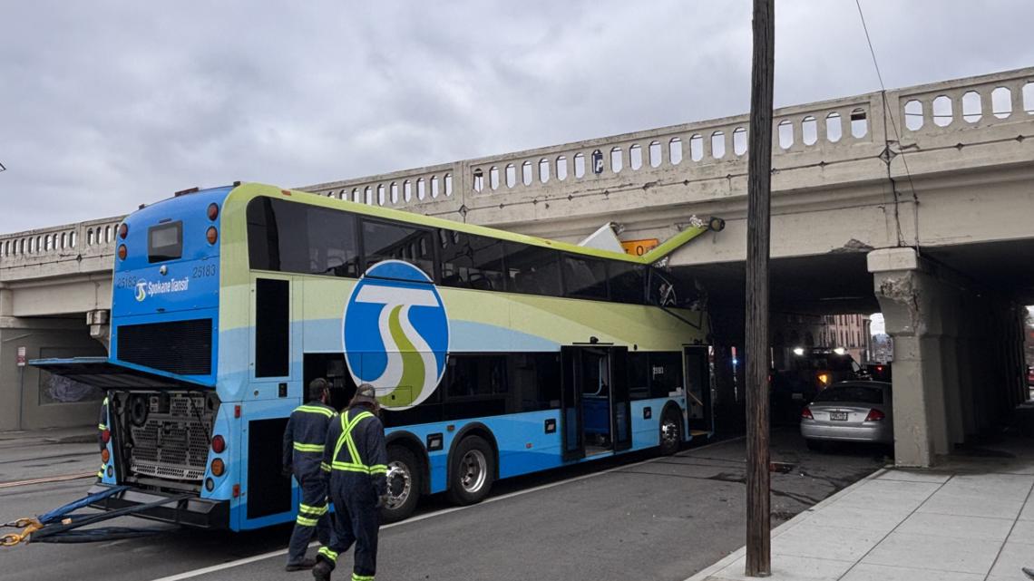 Spokane double-decker bus collides with railroad viaduct; four ...